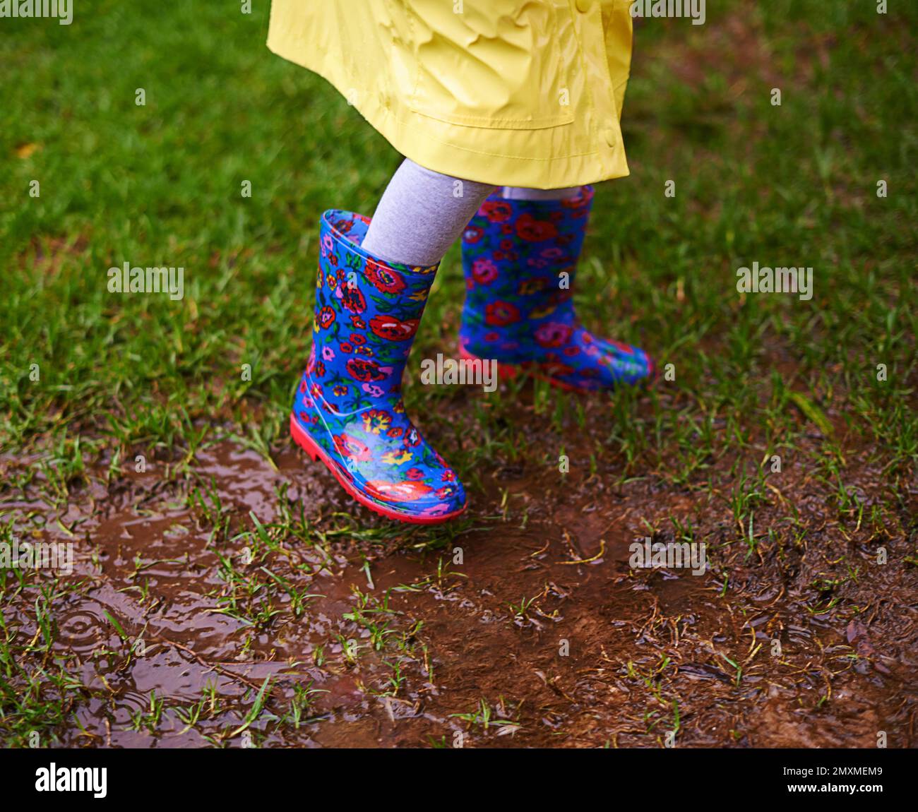 Joyful jumping in the rain. a child playing in the rain outside Stock ...
