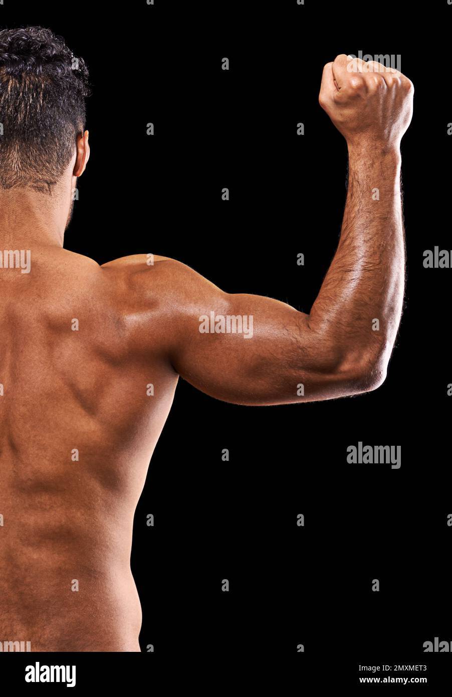Is this your goal. Rear-view shot of a muscular young man flexing his ...