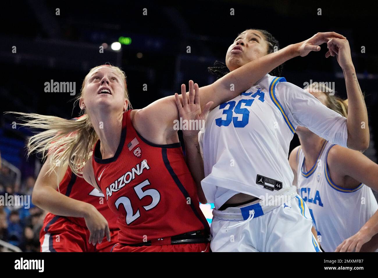 Arizona forward Cate Reese, left, and UCLA guard Camryn Brown battle ...