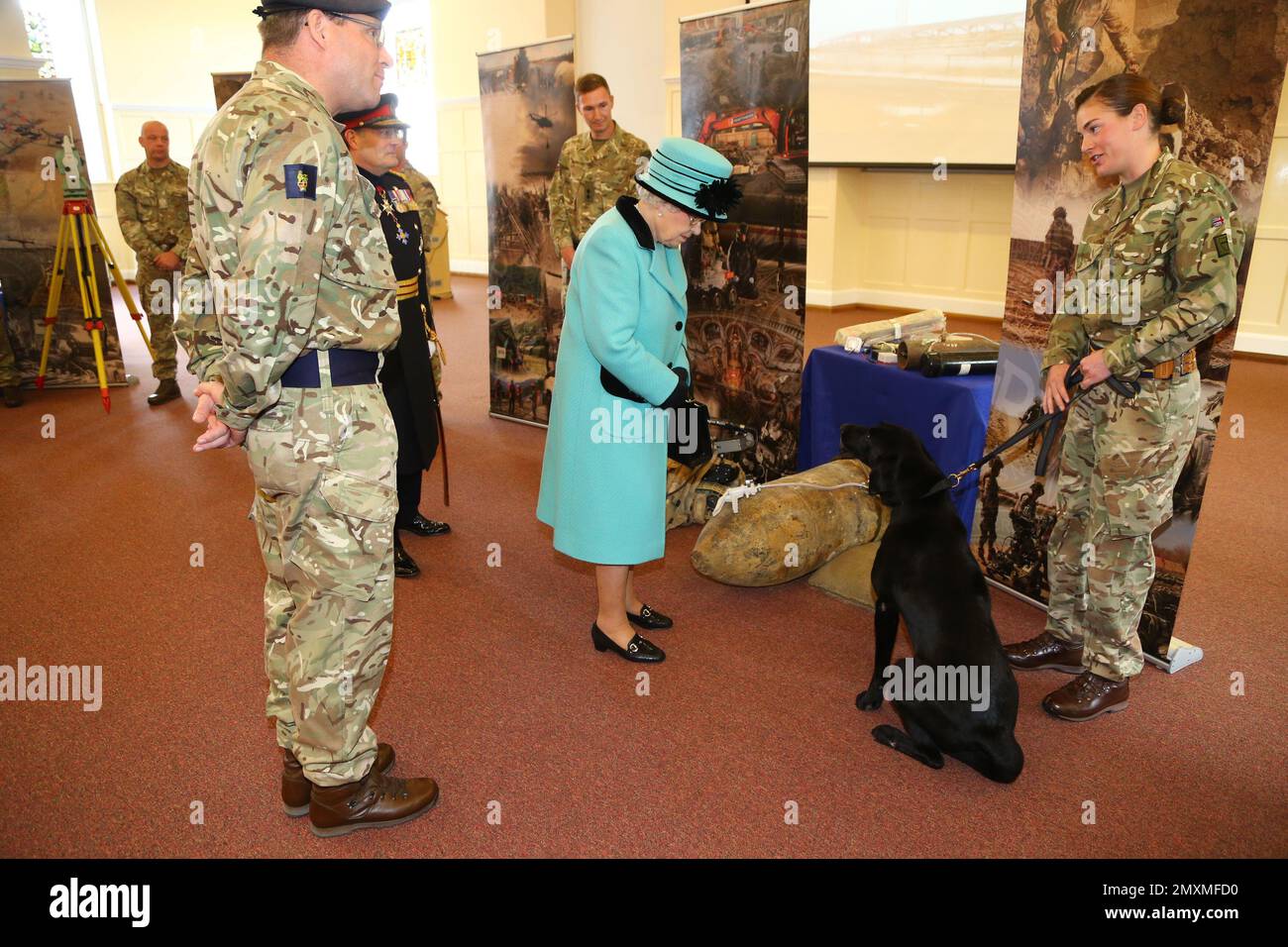 Britain's Queen Elizabeth II, centre, meets members, during a visit to ...