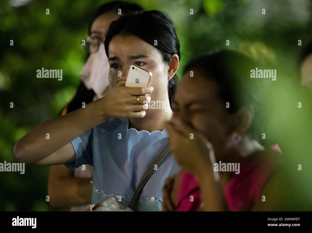 Thai women cry at Siriraj Hospital where Thai King Bhumibol Adulyadej was being treated in ...