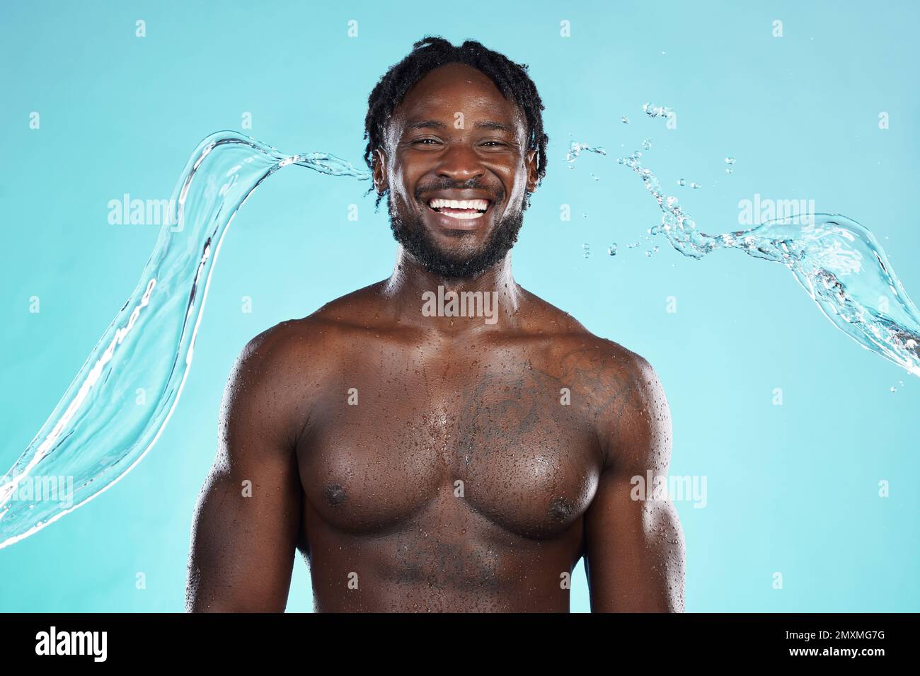 Water splash, portrait and black man isolated on blue background for ...