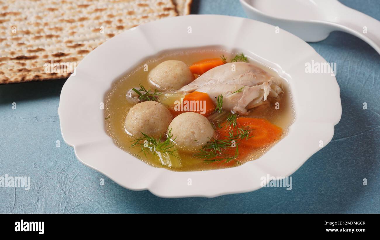 Jewish chicken broth with kneidlach (balls made with matzo meal). Matzo ...