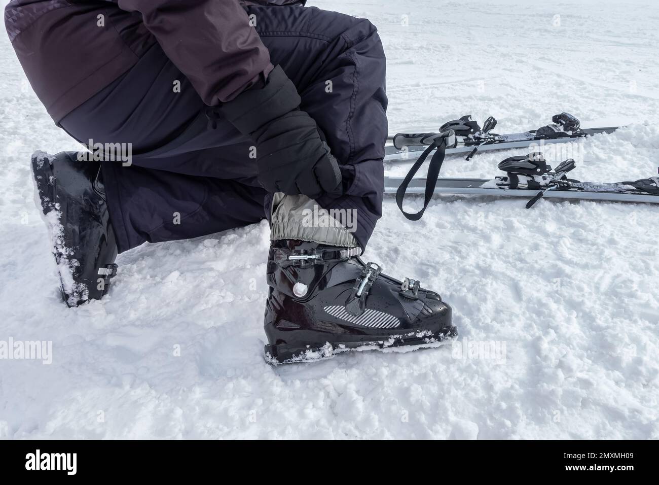 Attaching ski hi-res stock photography and images - Alamy