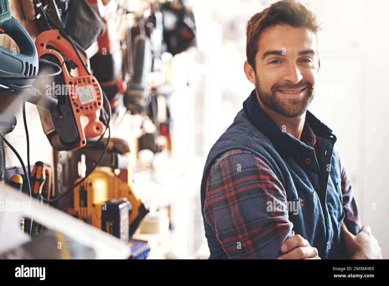 I have a tool for any occasion. Portrait of a man standing in his ...