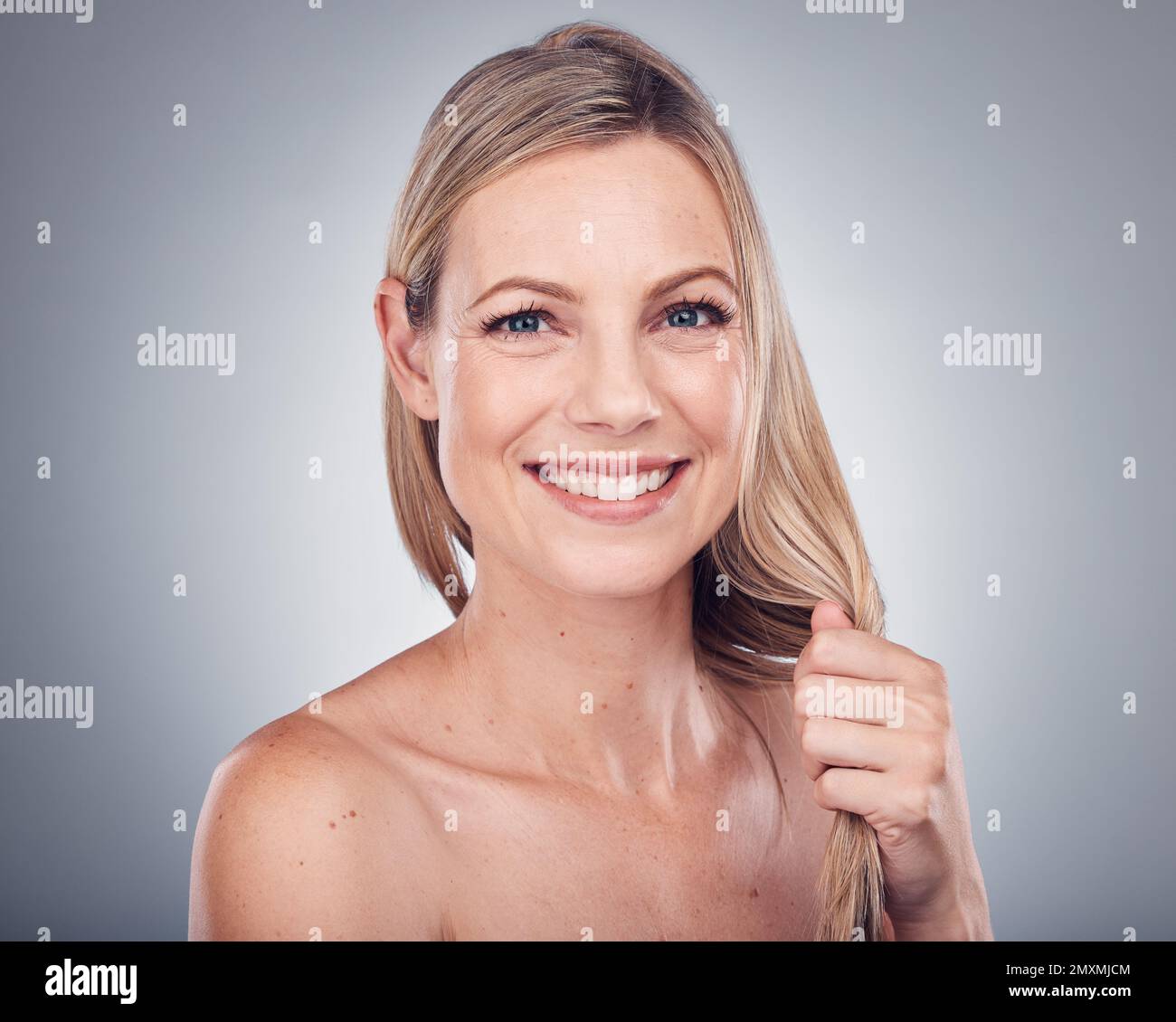 Hair care, beauty and portrait of a model in a studio with a keratin ...