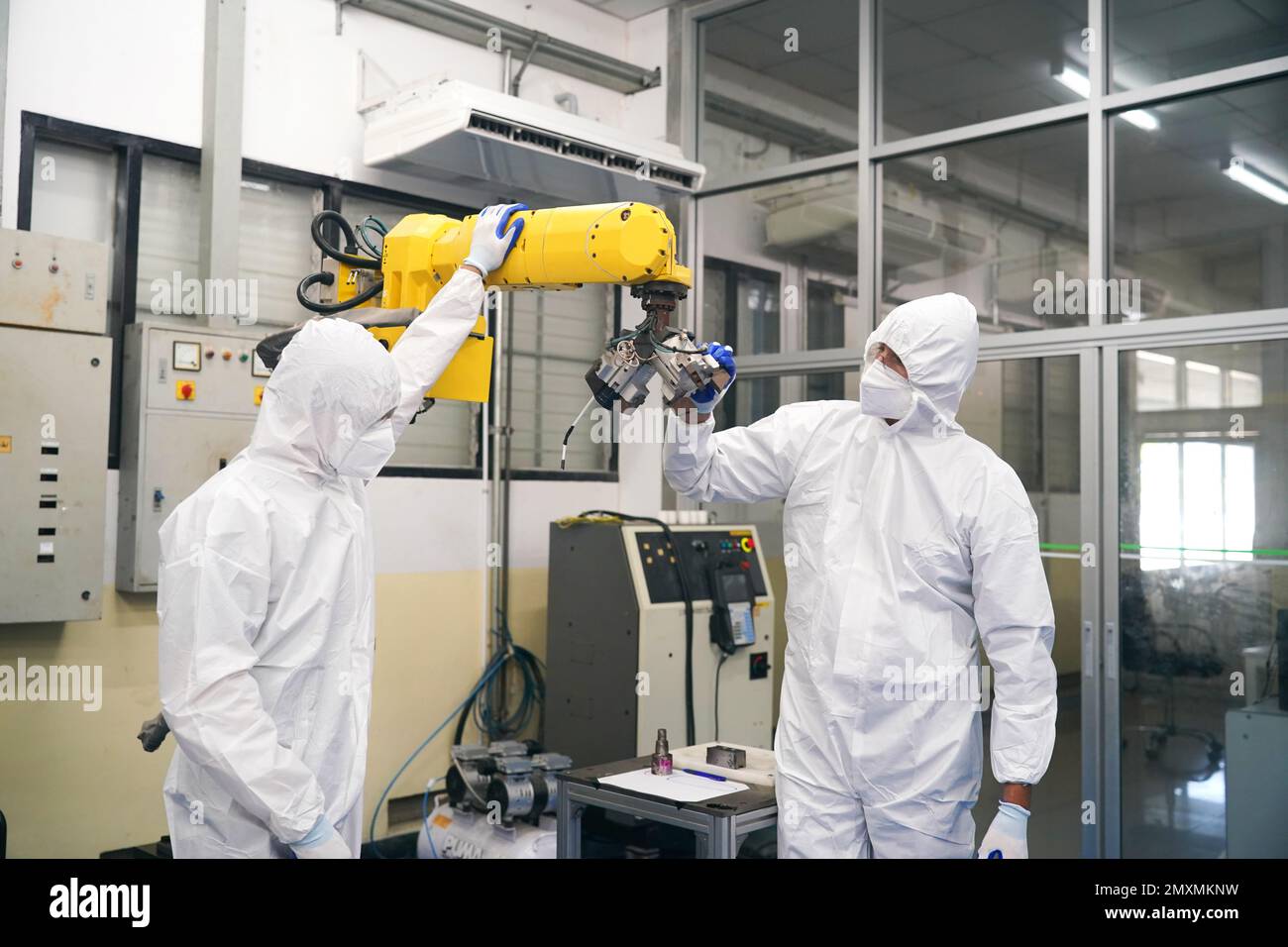 Engineers Maintenance Robot Arm at Lab in a High Tech Research ...