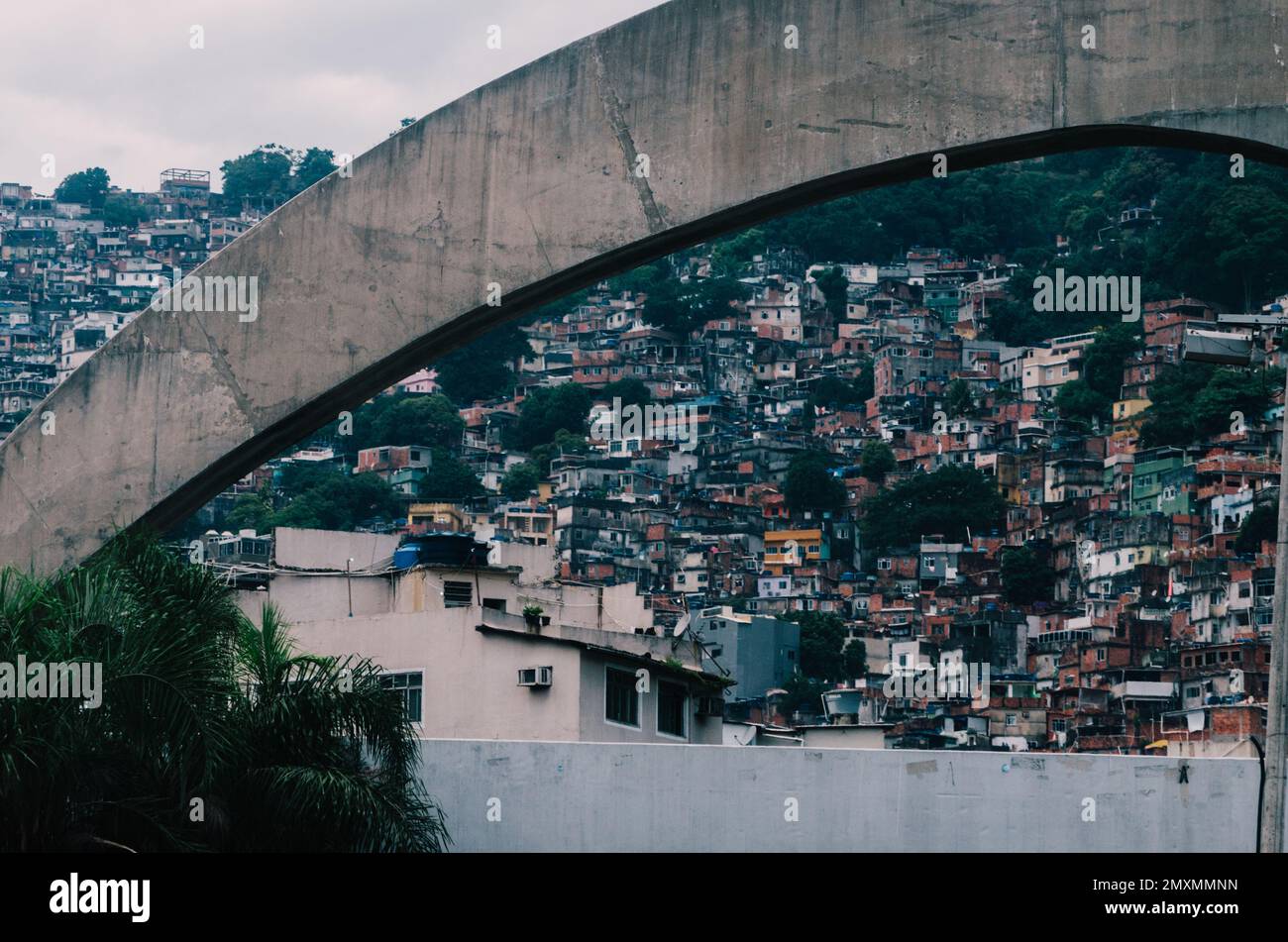 Reinforced concrete pedestrian bridge with the Rocinha favela in the ...
