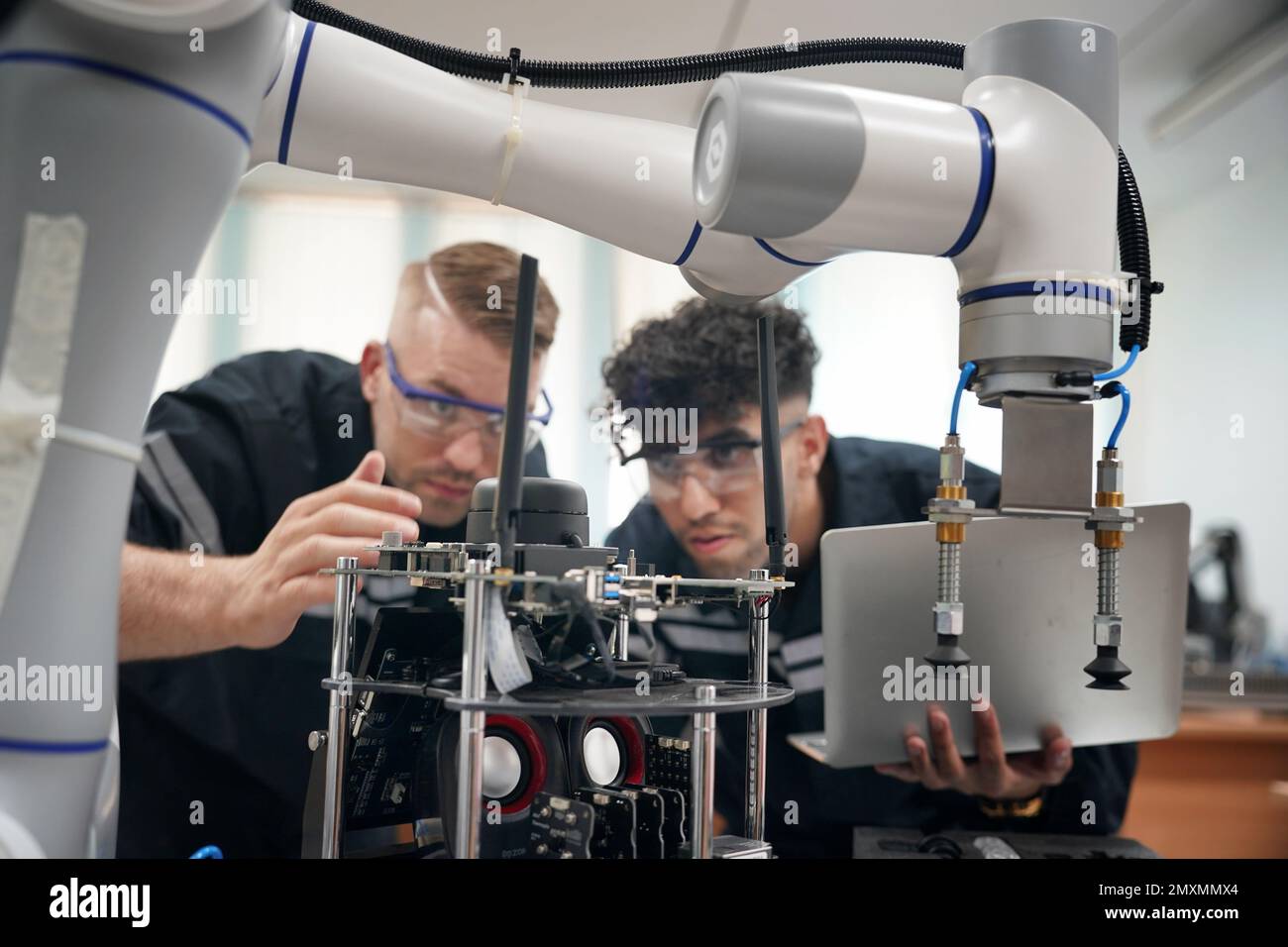 Engineers Maintenance Robot Arm at Lab in a High Tech Research ...