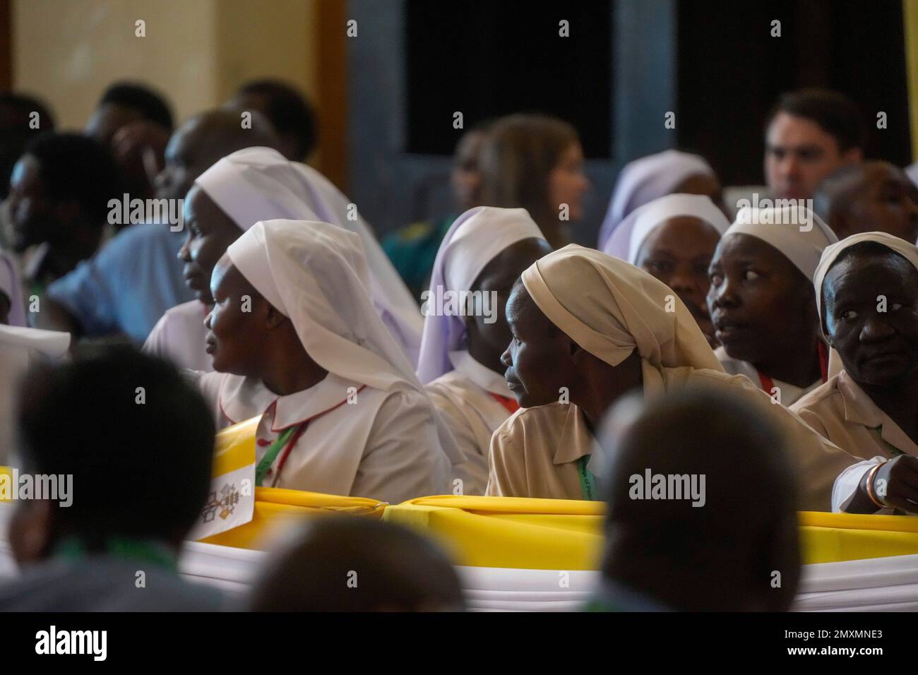 Nuns wait for the arrival of Pope Francis for a meeting with priests ...
