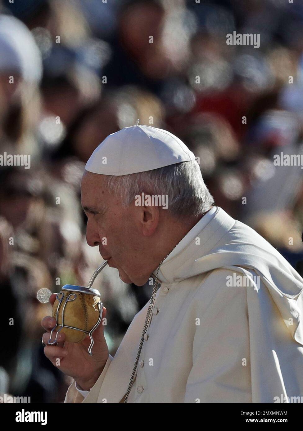 Pope Francis drinks from a mate gourd, a traditional South American cup ...