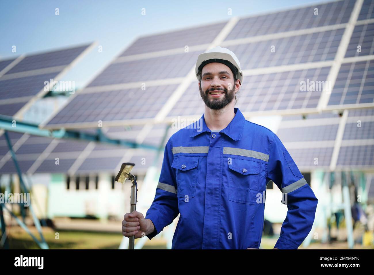 engineers installing solar panels on roof. Male engineers walking along ...
