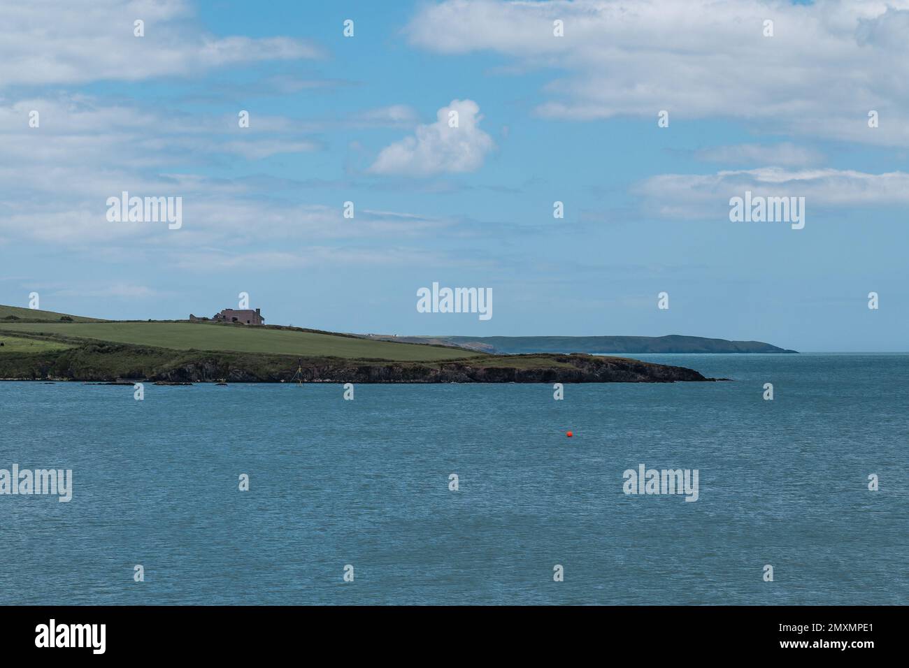 Irish seascape. The coast of the Atlantic Ocean. Green grass field on ...