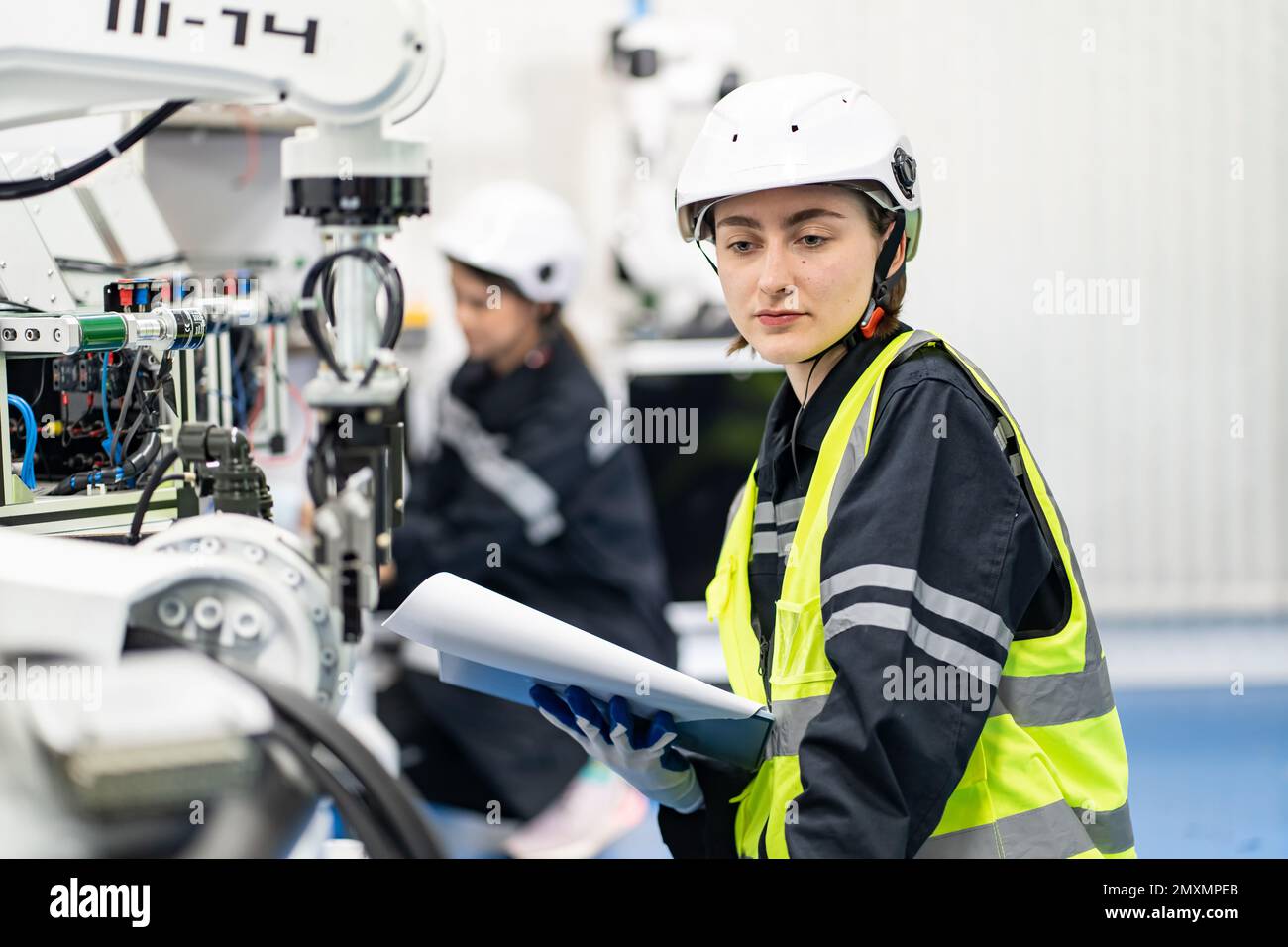 Engineer check and control welding robotics automatic arms machine in ...