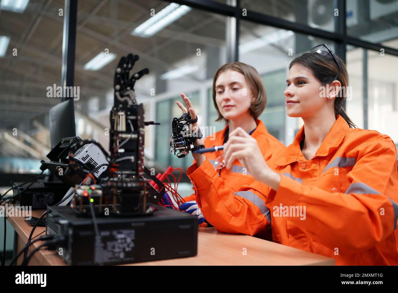 Engineers Maintenance Robot Arm at Lab in a High Tech Research ...