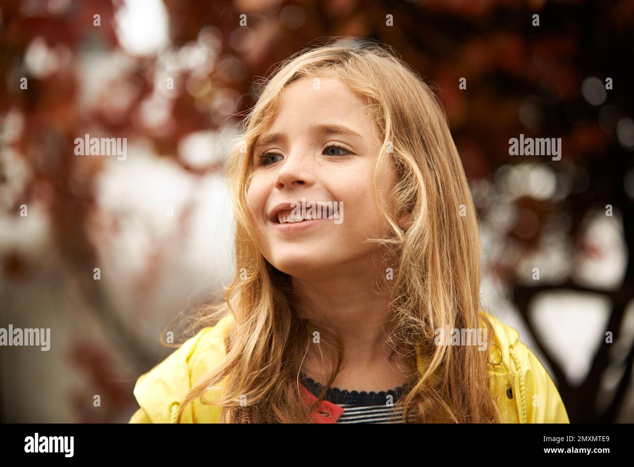 I wont let a little rain stop my fun. A cute little girl wearing a ...