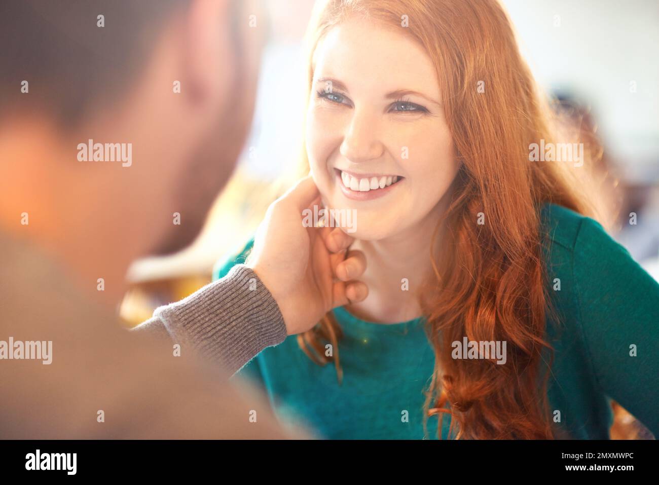 Taken by her beauty. an affectionate young couple on a date Stock Photo ...