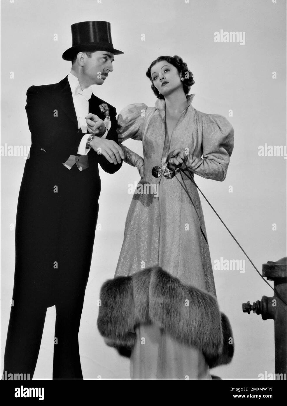 WILLIAM POWELL as Nick Charles and MYRNA LOY as Nora Charles publicity portrait for AFTER THE ...