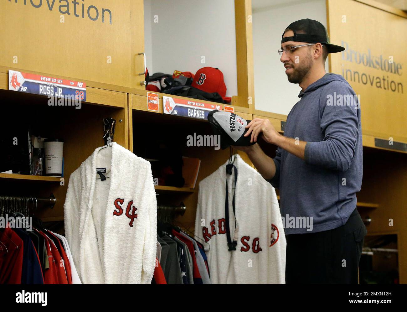 Boston Red Sox pitcher Matt Barnes cleans out his locker in the team's ...