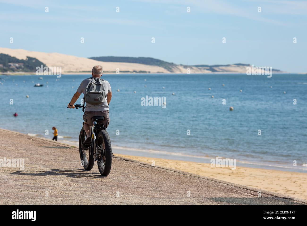Person riding a bicycle on a cycle path Stock Photo - Alamy