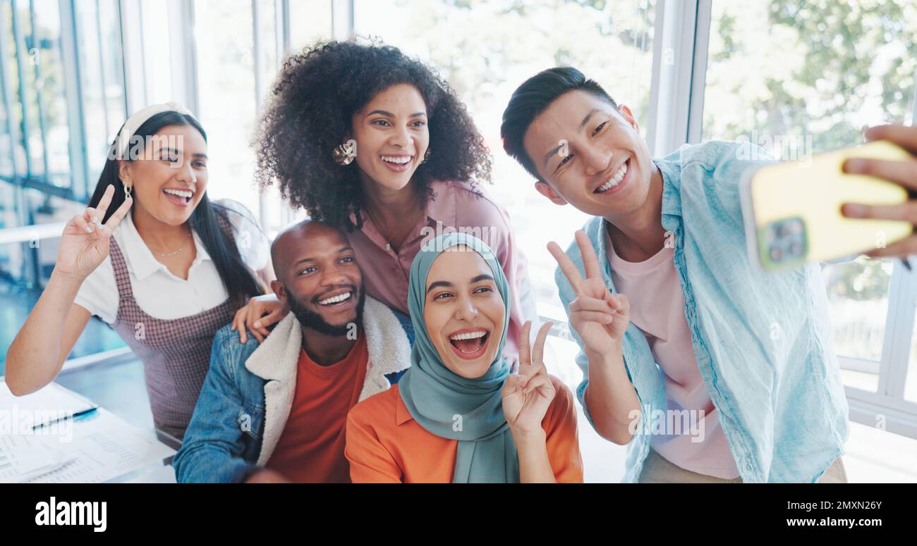 Phone, team building or happy employees take a selfie in an office room ...