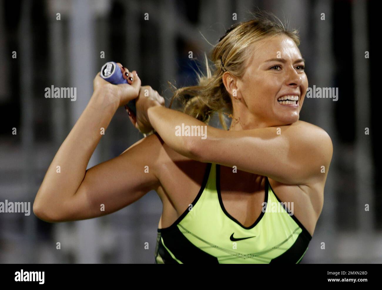 Maria Sharapova hits during a World Team Tennis exhibition to benefit ...