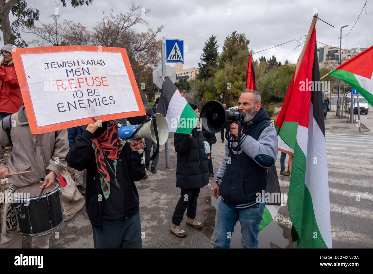 Palestinians and Israeli left-wing activists holds Palestinian flags ...