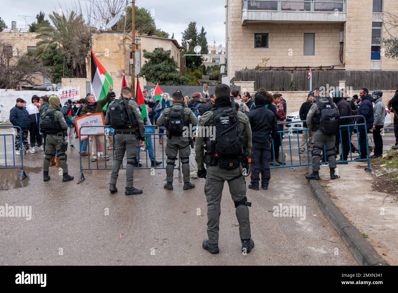 Members of the Israeli security force watch over as Israeli left-wing ...