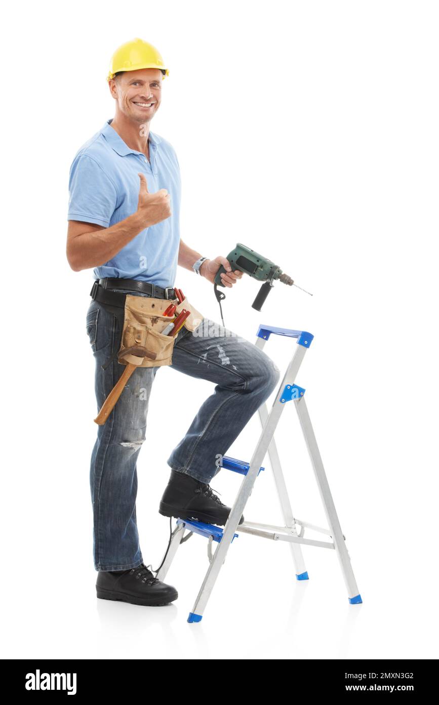 Thumbs up, portrait and repairman in a studio with a drill, tool belt ...