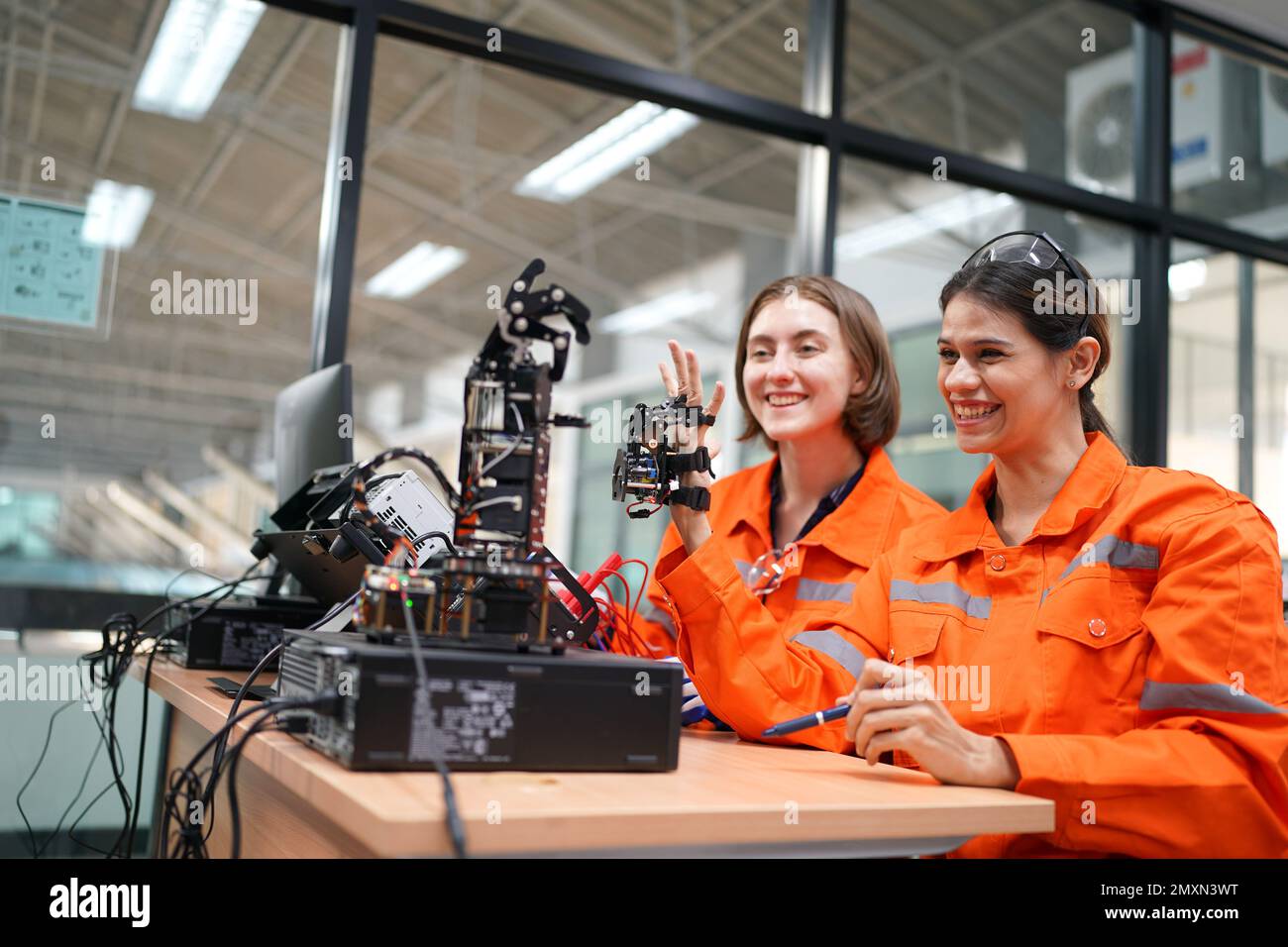 Engineers Maintenance Robot Arm at Lab in a High Tech Research ...