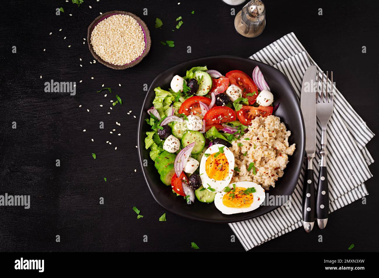 Healthy breakfast. Greek inspired savory oatmeal with fresh cucumber ...