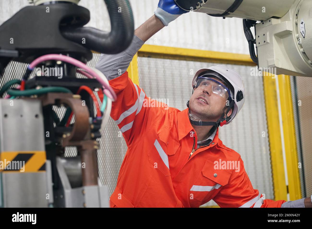 Engineers Maintenance Robot Arm at Lab in a High Tech Research ...