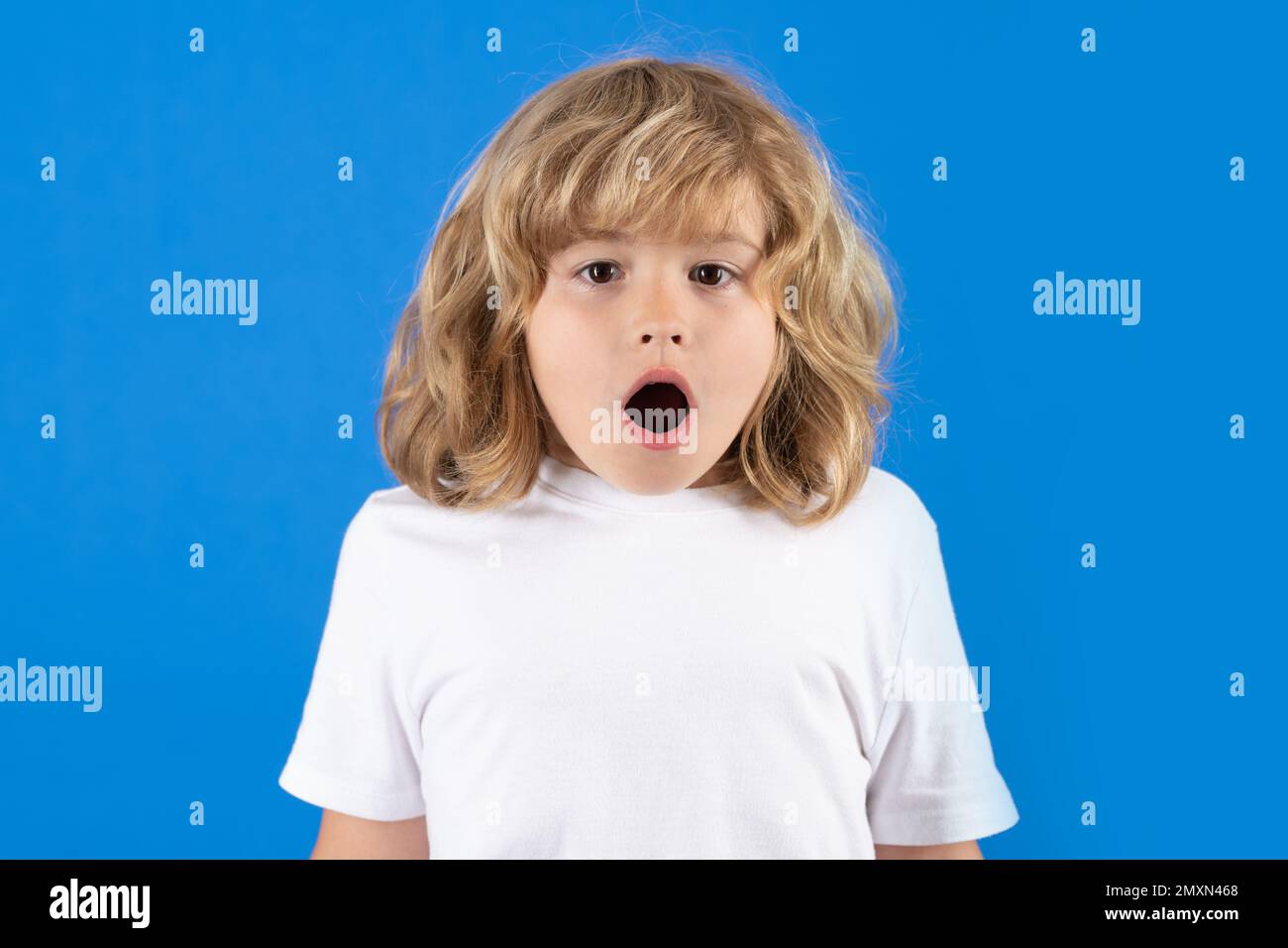 Shocked kid boy on studio isolated background. Surprised face, excited ...
