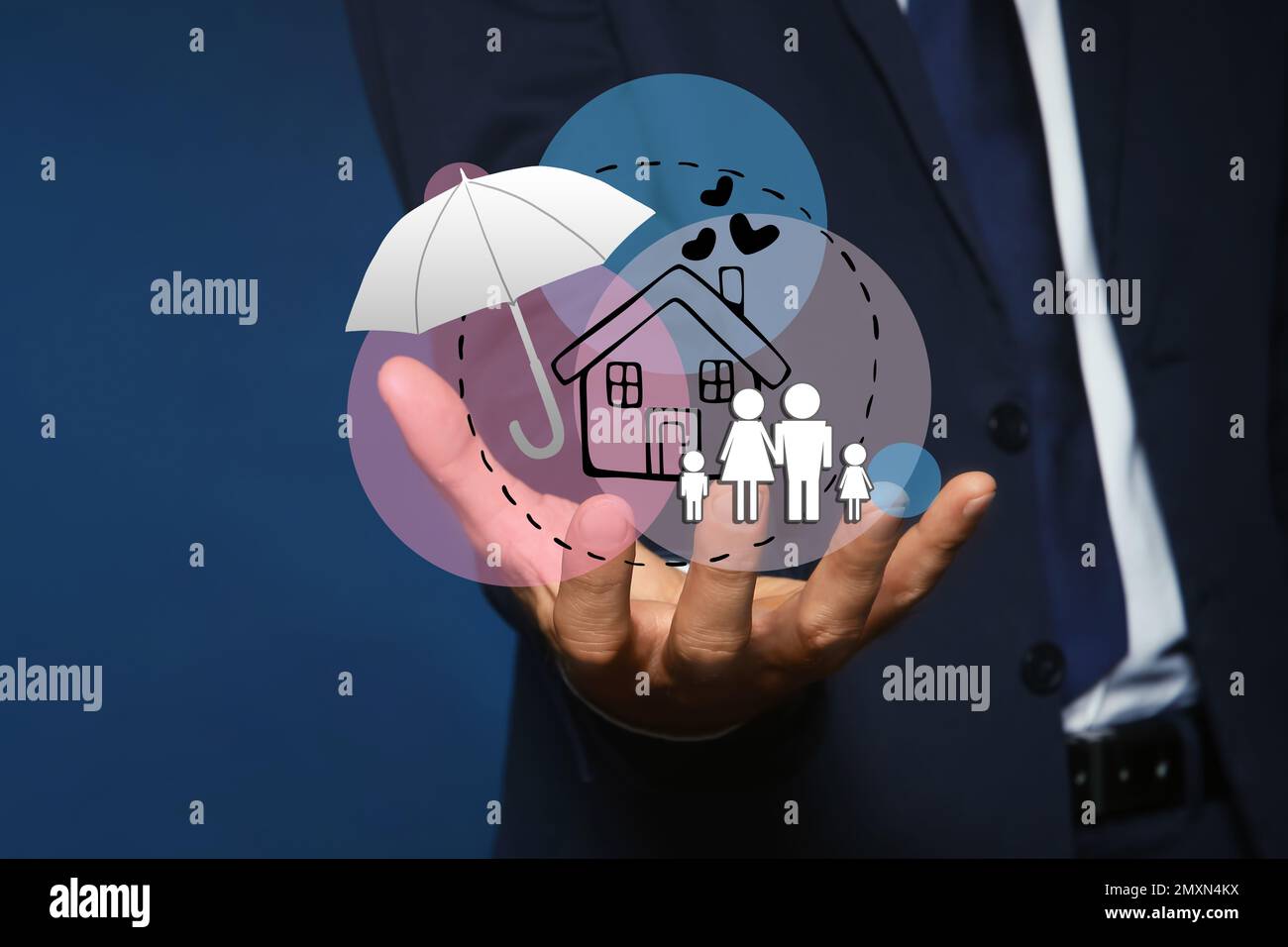 Insurance concept - umbrella demonstrating protection. Man with ...