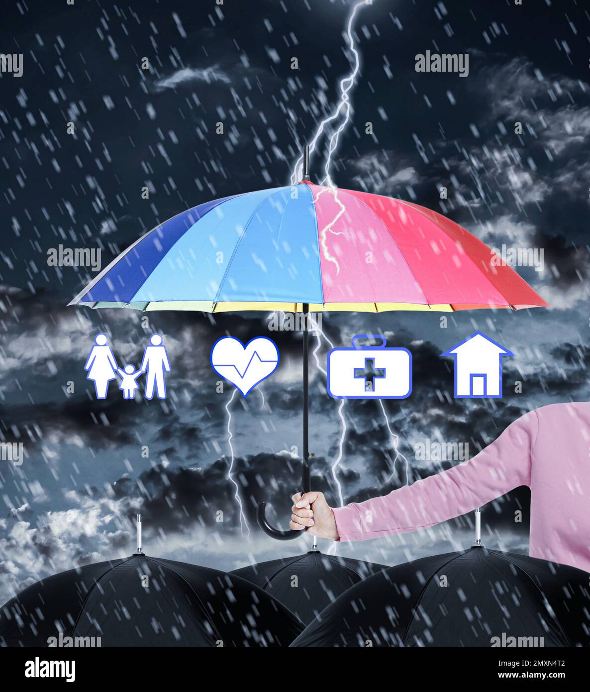 Insurance agent covering illustrations with rainbow umbrella during ...
