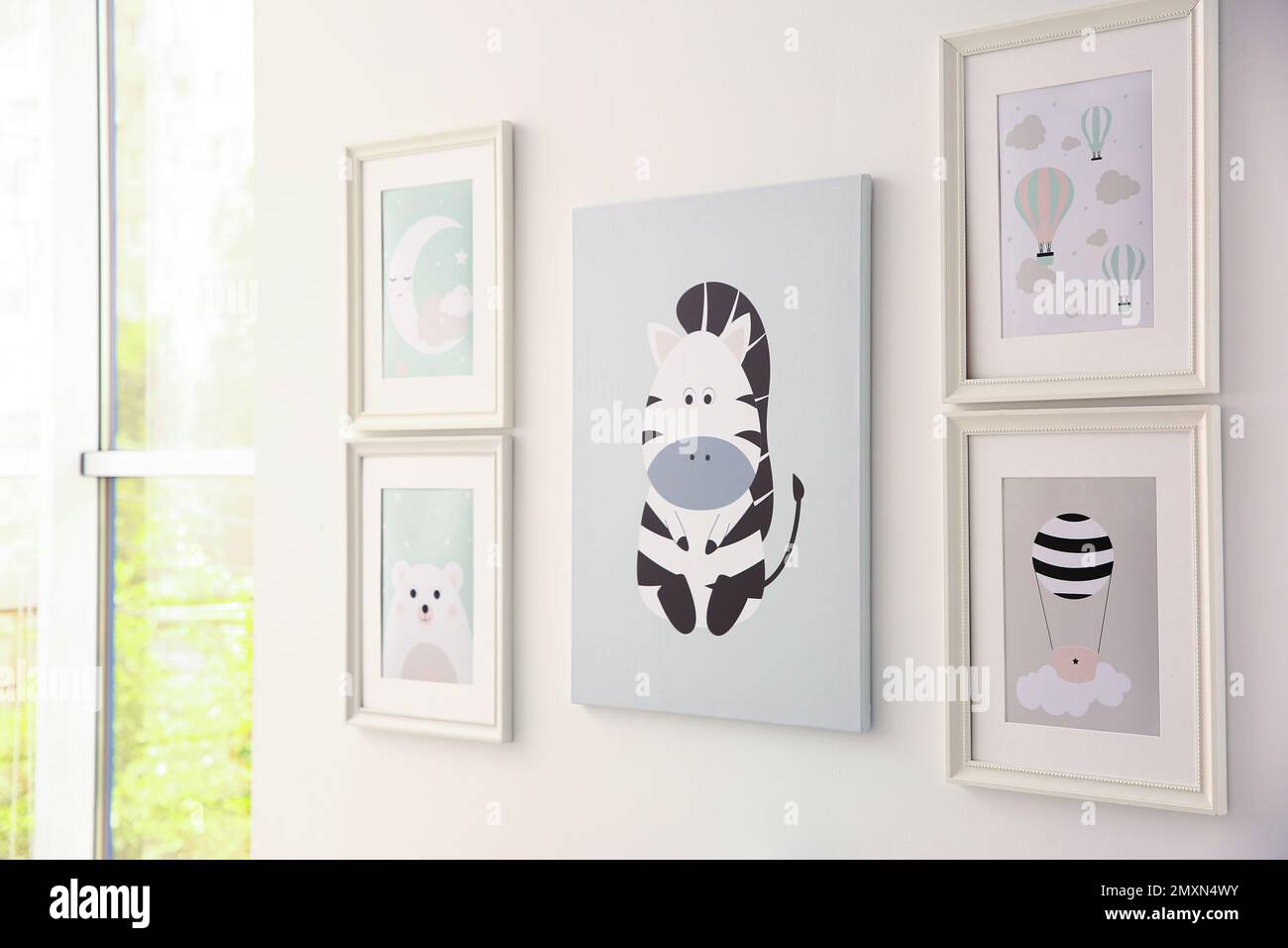 Adorable pictures on wall indoors. Interior design Stock Photo - Alamy
