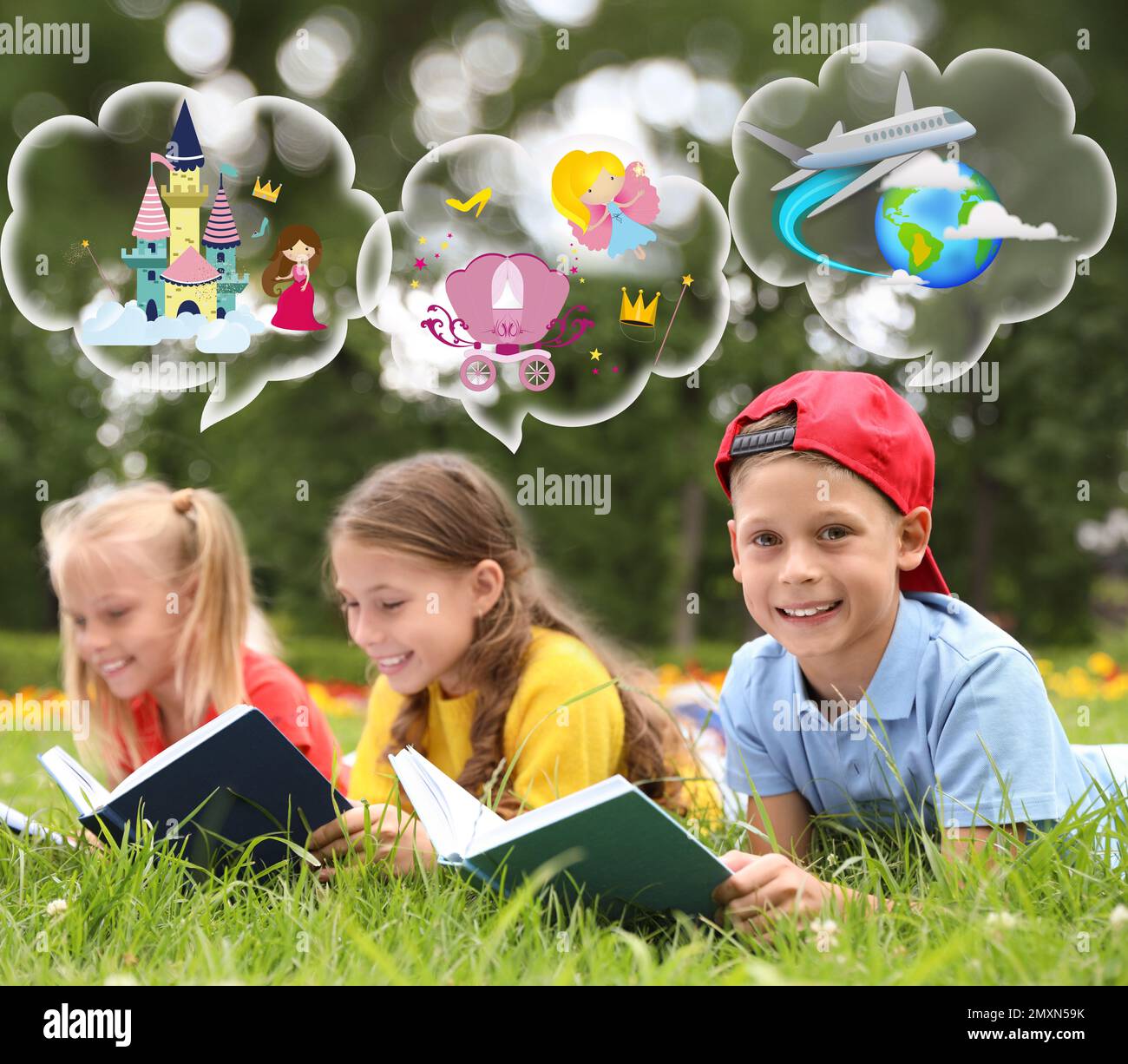 Happy children reading books on green grass outdoors Stock Photo - Alamy