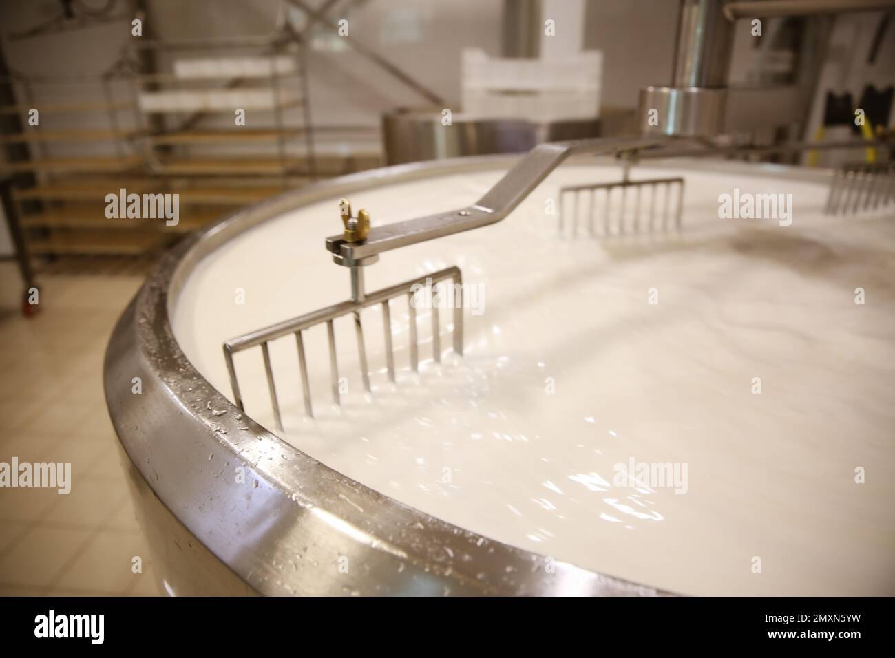 Milk in curd preparation tank at cheese factory Stock Photo - Alamy