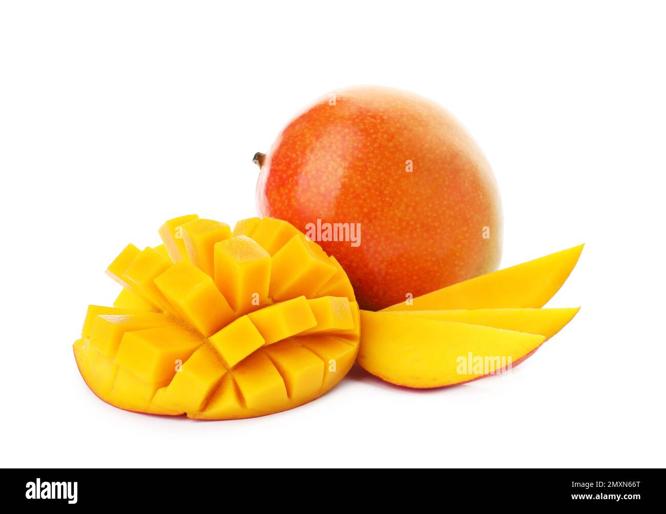 Whole and cut ripe mangoes isolated on white. Exotic fruit Stock Photo ...