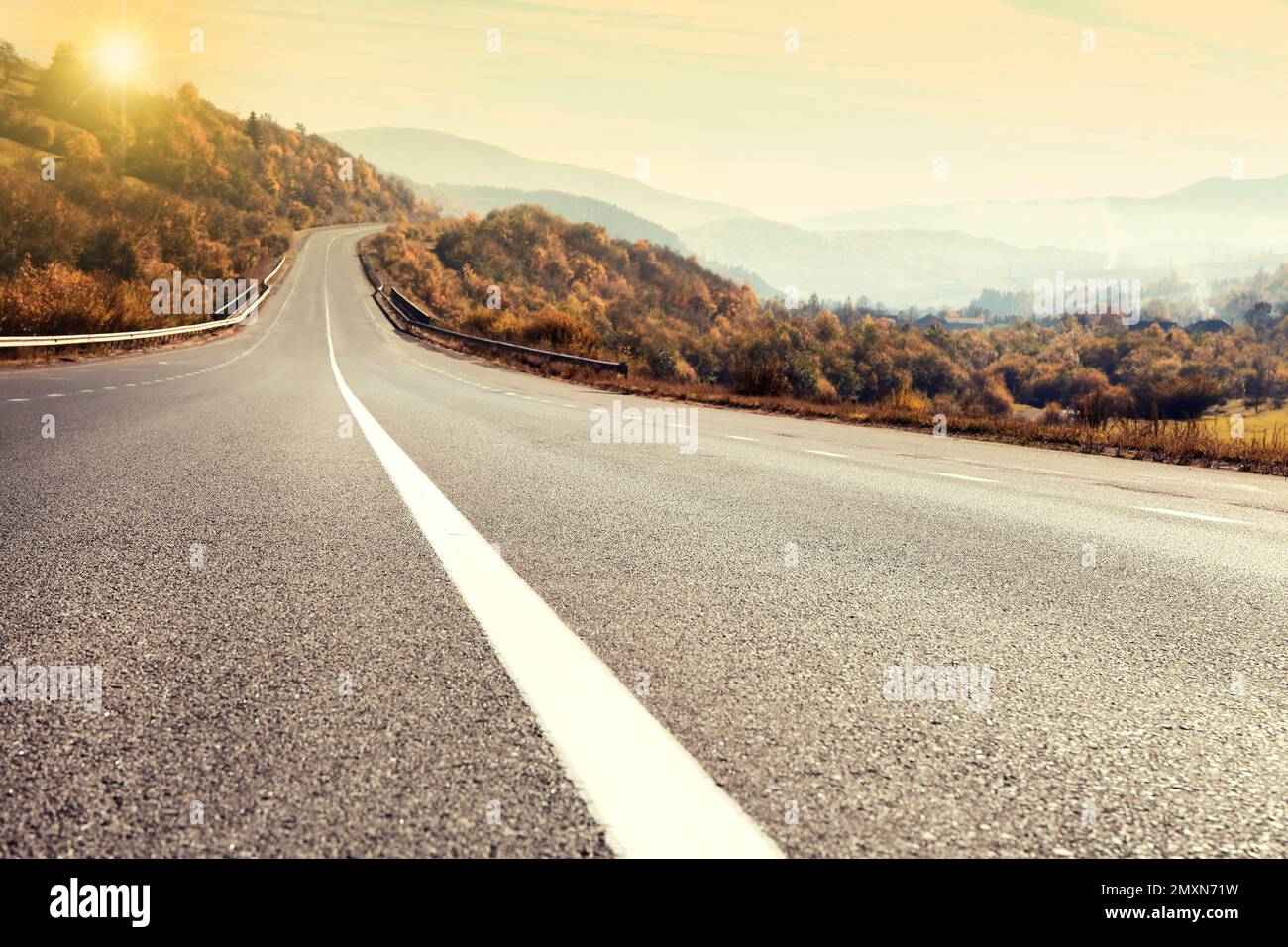 Road trip. Beautiful view of asphalt highway on sunny day Stock Photo ...