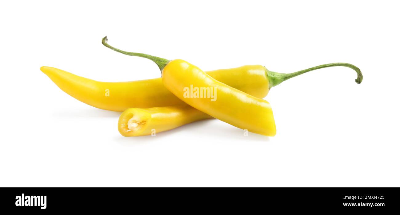 Cut and whole ripe yellow chili peppers isolated on white Stock Photo ...