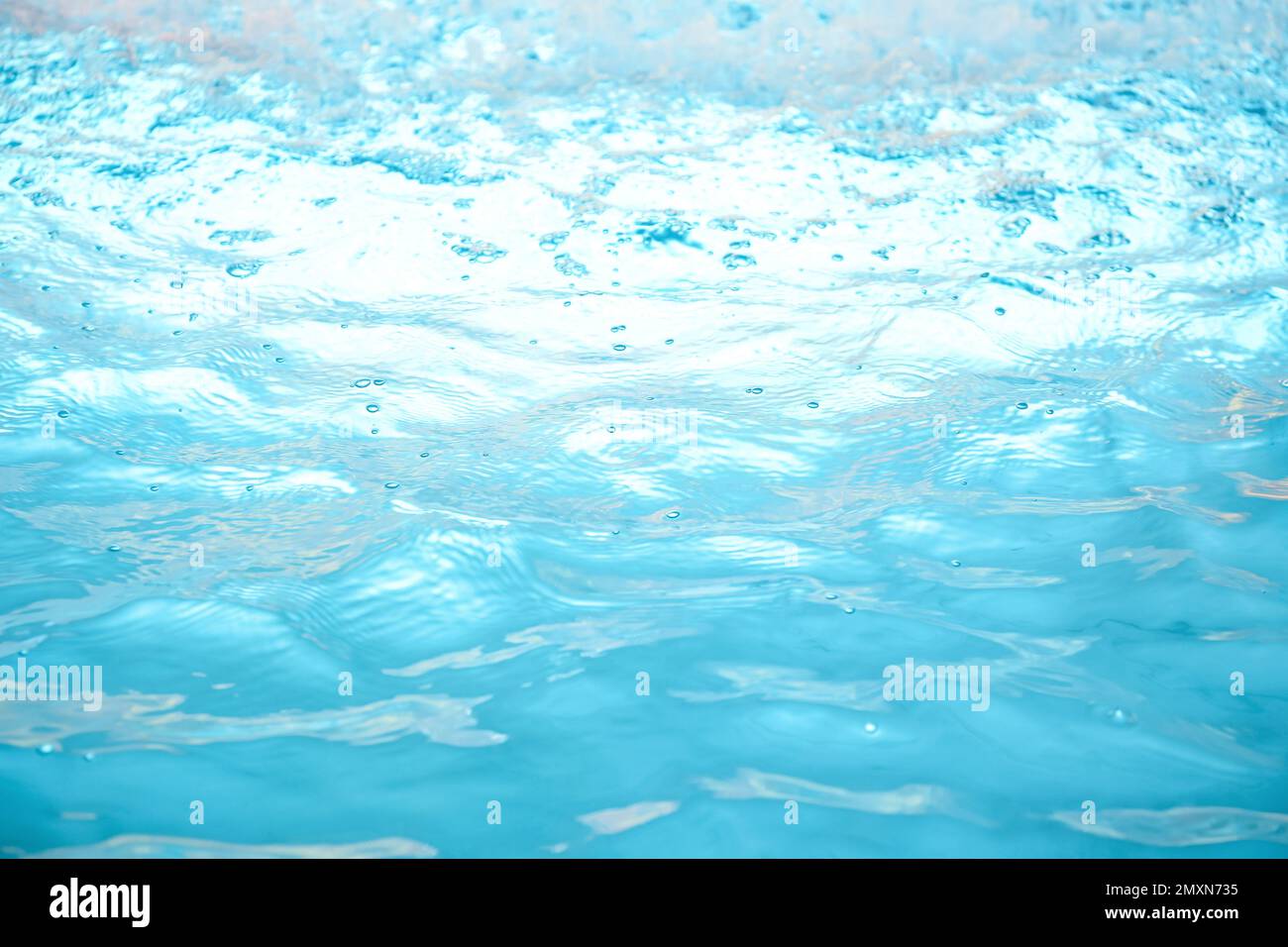 View of water splashing in swimming pool Stock Photo - Alamy