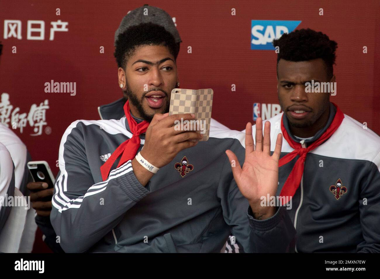 New Orleans Pelicans player Anthony Davis uses his phone during a ...