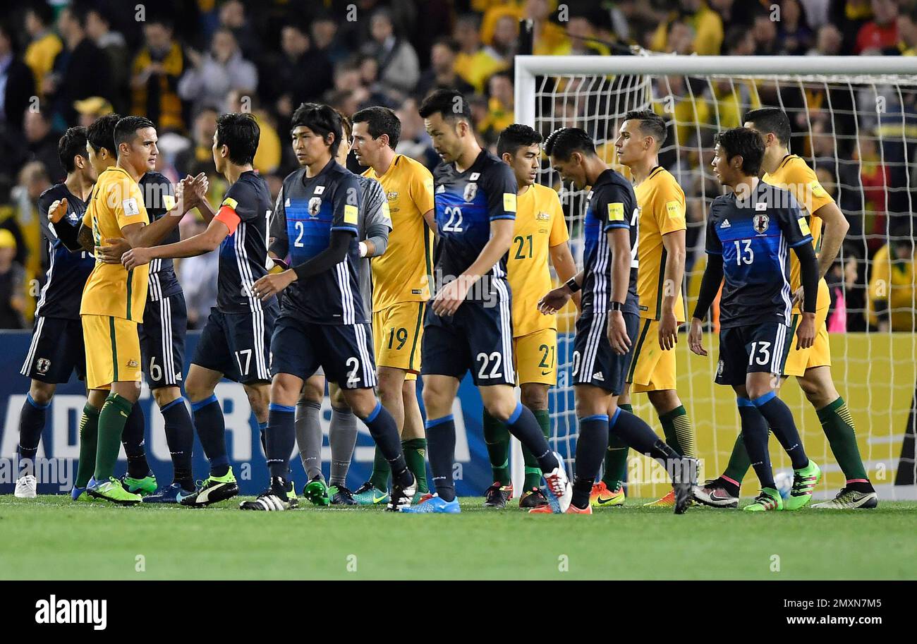 Australian and Japanese players shake hands following their World Cup ...