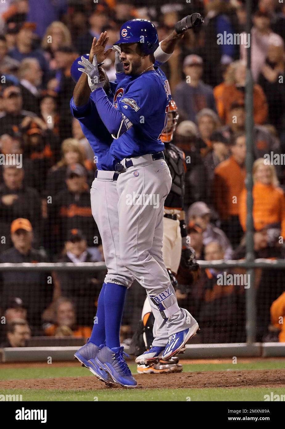 Chicago Cubs' Kris Bryant, right, celebrates with Dexter Fowler after ...