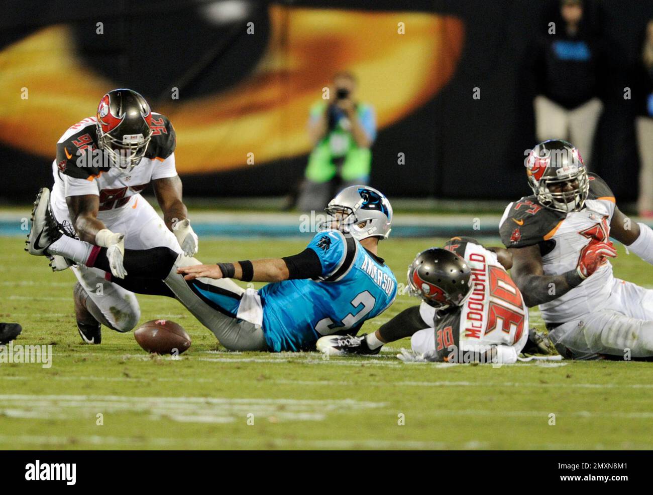 Carolina Panthers' Derek Anderson (3) fumbles the ball as Tampa Bay ...