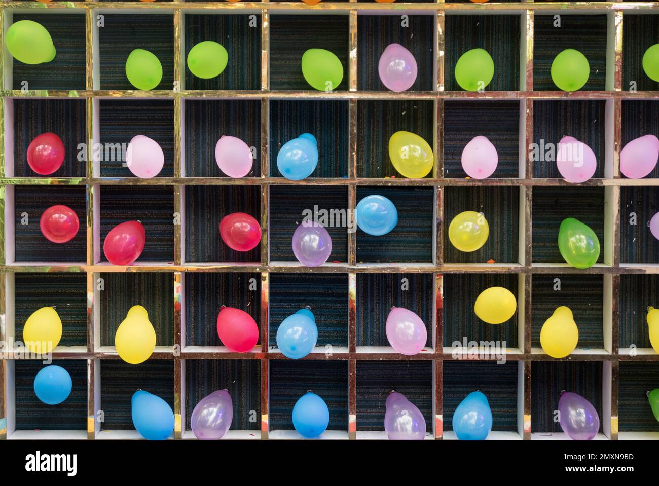 Colorful balloon game at a local fair Stock Photo - Alamy