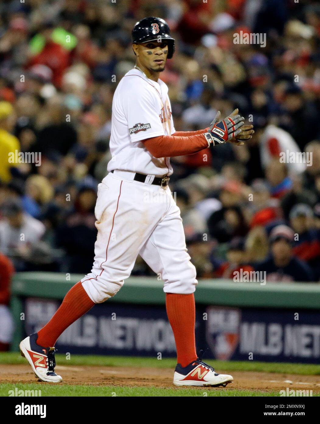 Boston Red Sox's Xander Bogaerts claps after hitting a single during ...