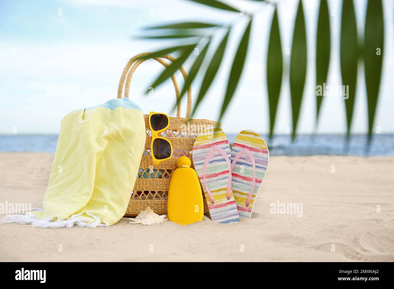 Different stylish beach objects and seashell on sand near sea Stock ...