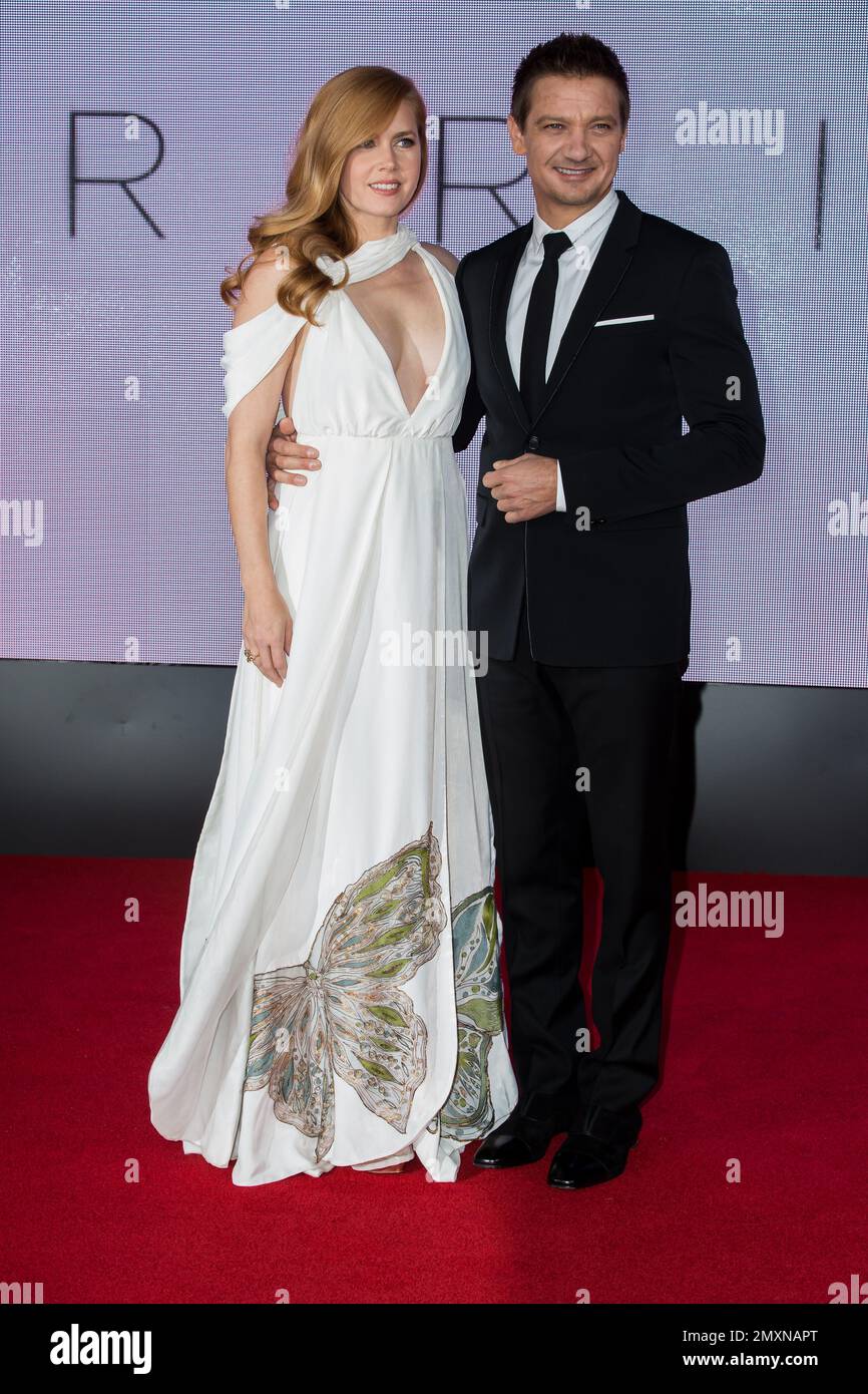 Actors Amy Adams and Jeremy Renner pose for photographers on arrival at ...